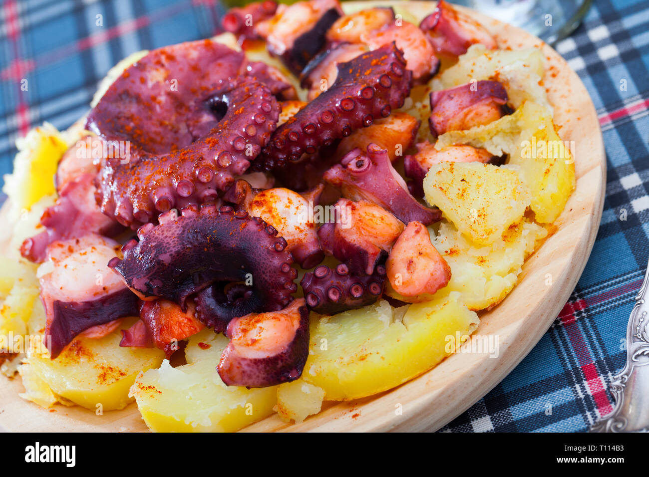 Pulpo a la gallega, spanish seafood dish of baked octopus tentacle with ...