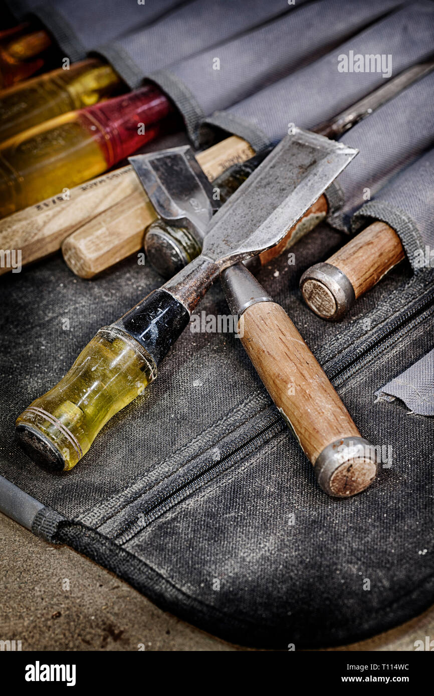 A grungy image of well used woodworking chisels in a chisel pouch Stock ...