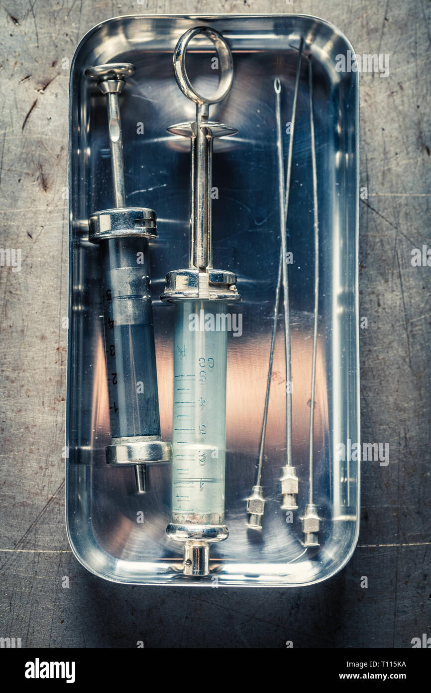 Old syringes with a needle in a stainless steel container Stock Photo ...