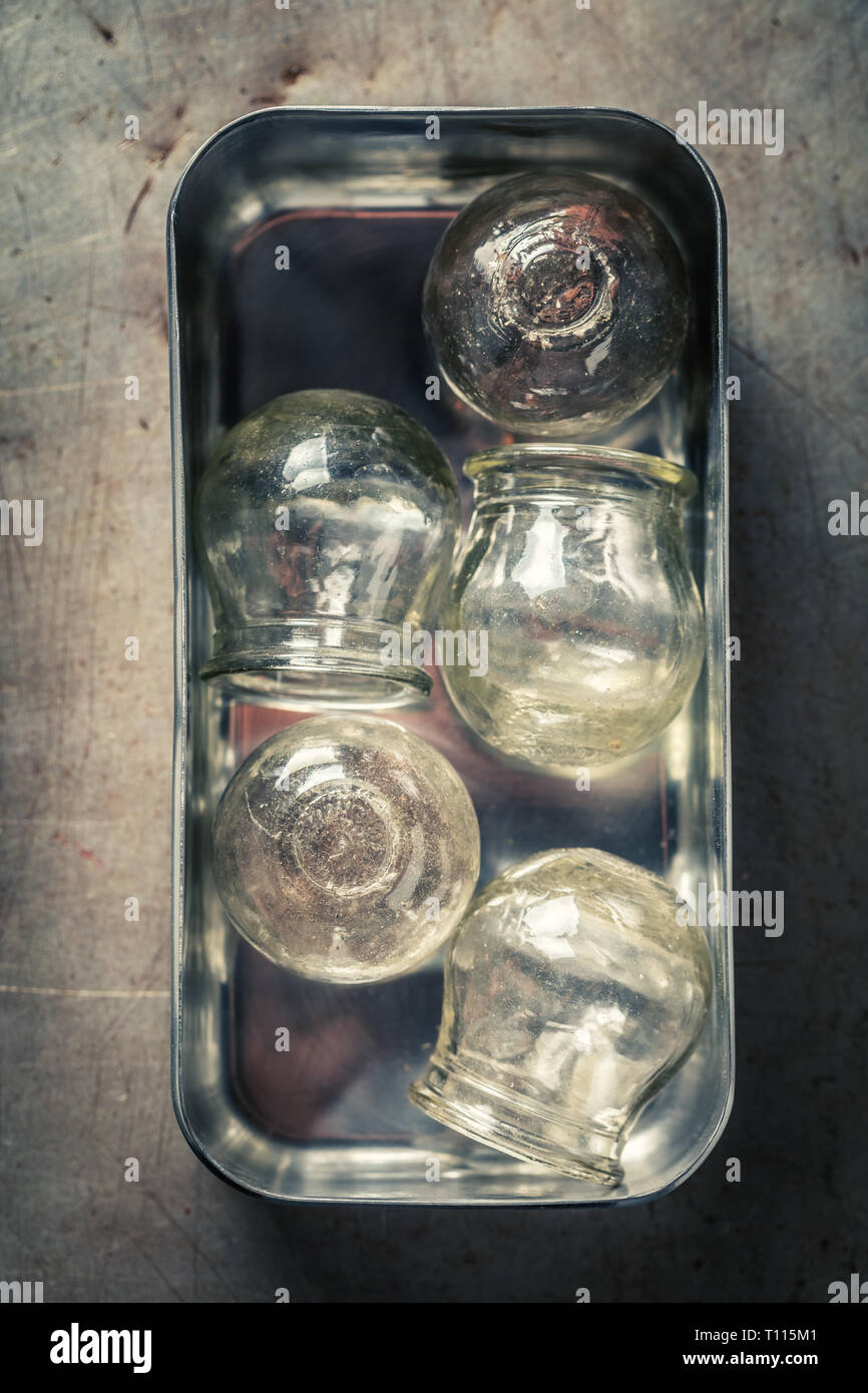 Retro medical cupping glass in a stainless steel container Stock Photo ...