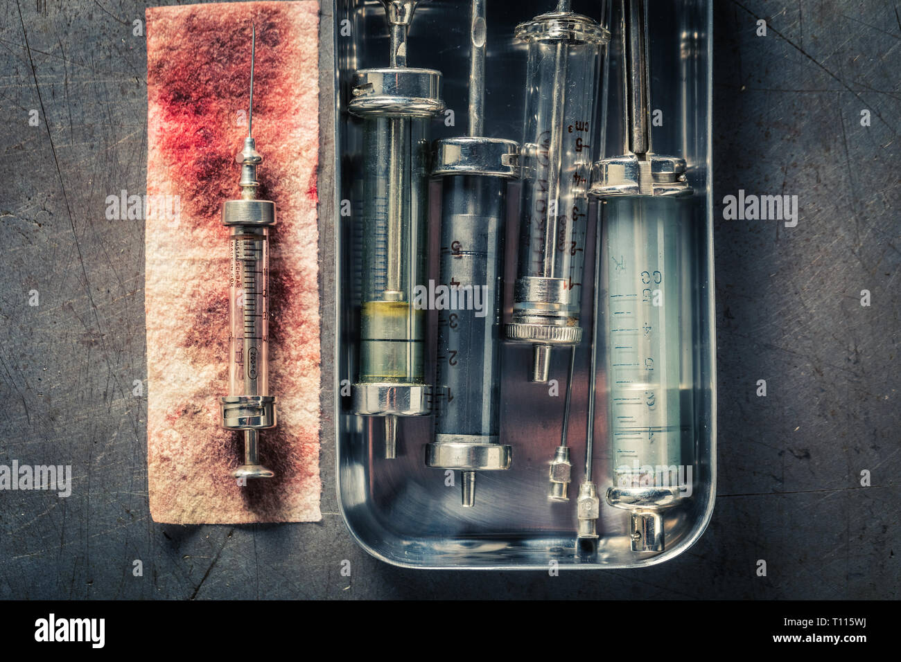 Antique syringes with a needle in a stainless steel container Stock ...