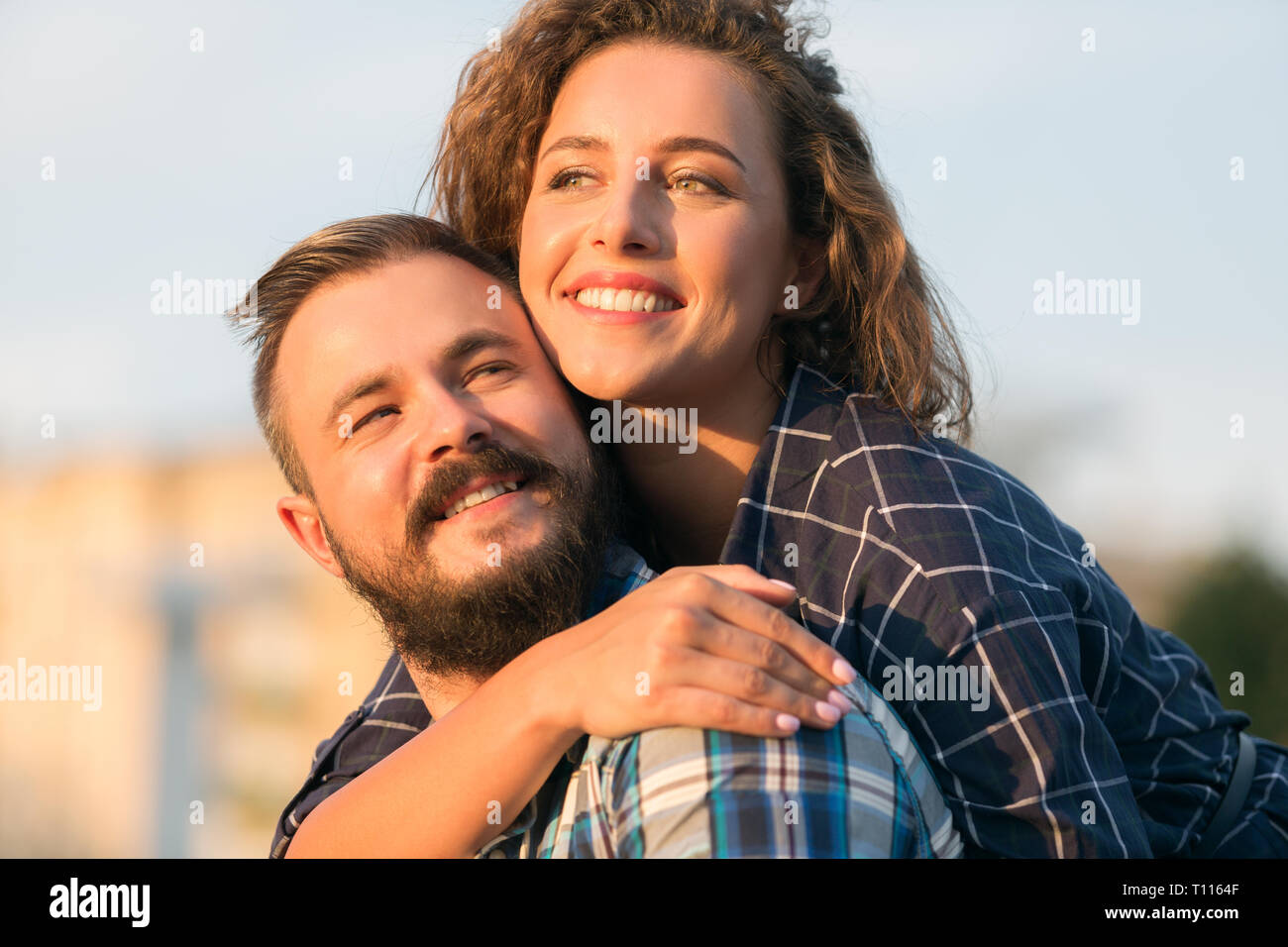 Man giving piggyback ride to girlfriend, having fun Stock Photo - Alamy