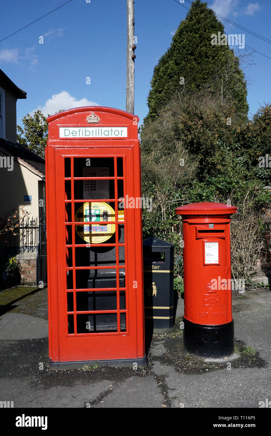 red GPO telephone box repurposed to contain village defibrillator Stock ...