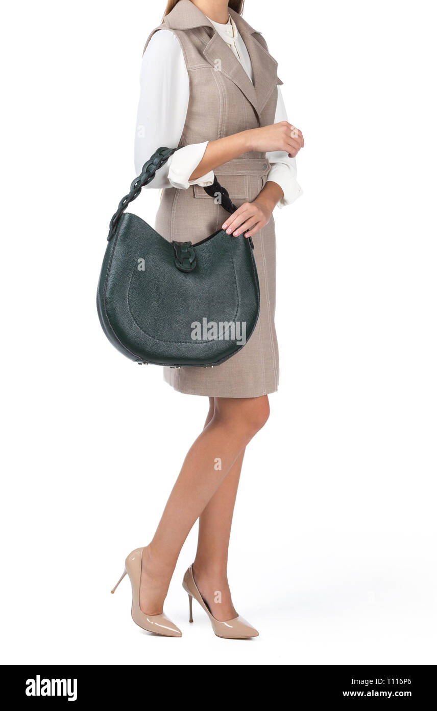 Woman holding a handbag isolated on white background Stock Photo - Alamy