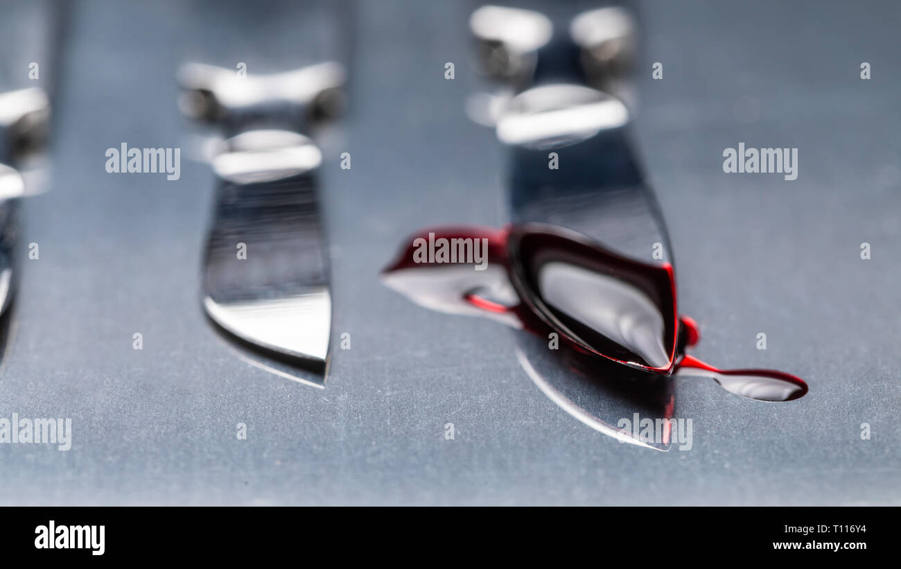 Stainless steel scalpels on stainless steel table with blood Stock ...
