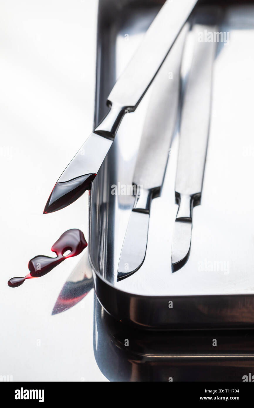 Closeup of scalpels on stainless steel table with blood Stock Photo - Alamy