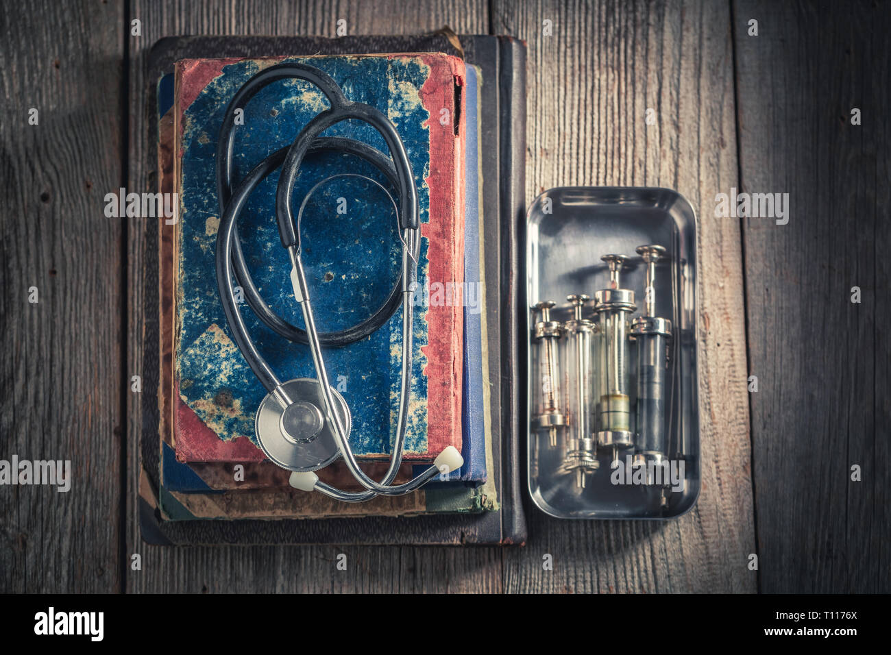 Old stethoscope and glass syringes as medical education concept Stock ...