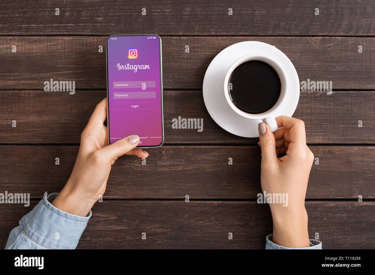 Woman holding iPhone with Instagram application on screen Stock Photo ...