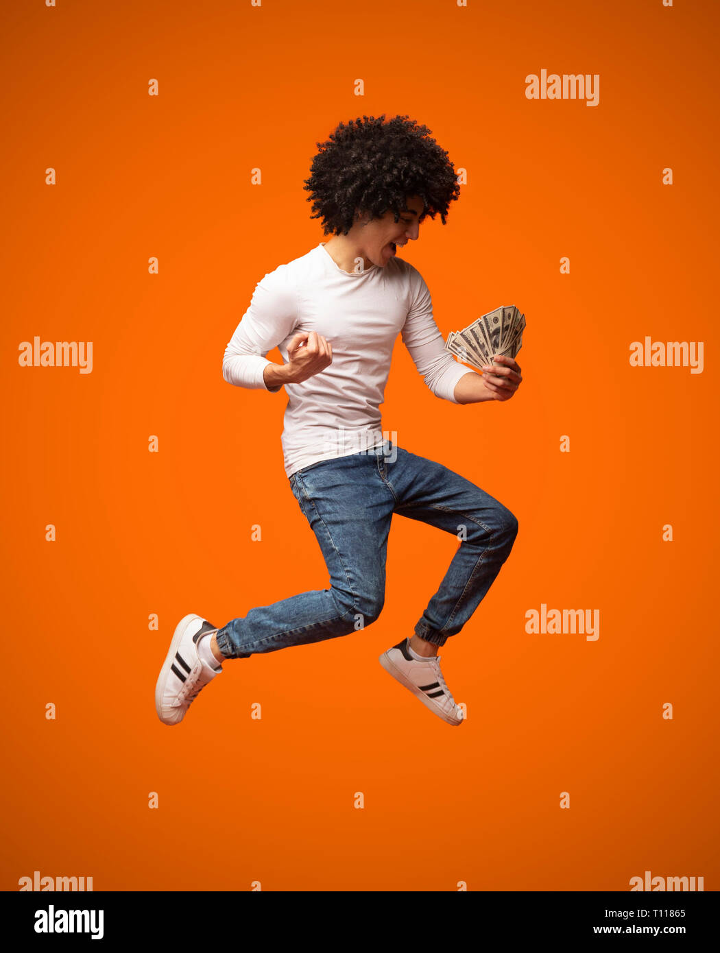 Handsome jumping young man hi-res stock photography and images - Alamy