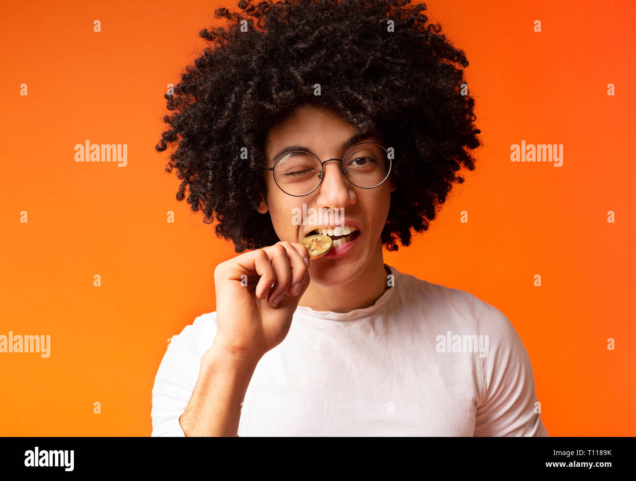 Biting gold coin hi-res stock photography and images - Alamy