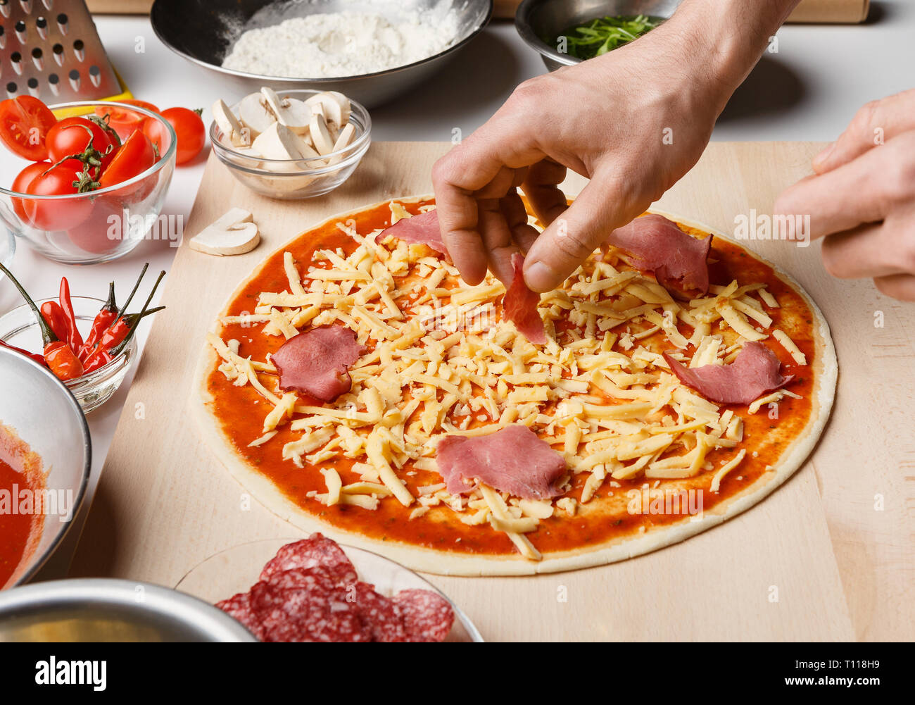 Man hand prepare pizza hi-res stock photography and images - Alamy