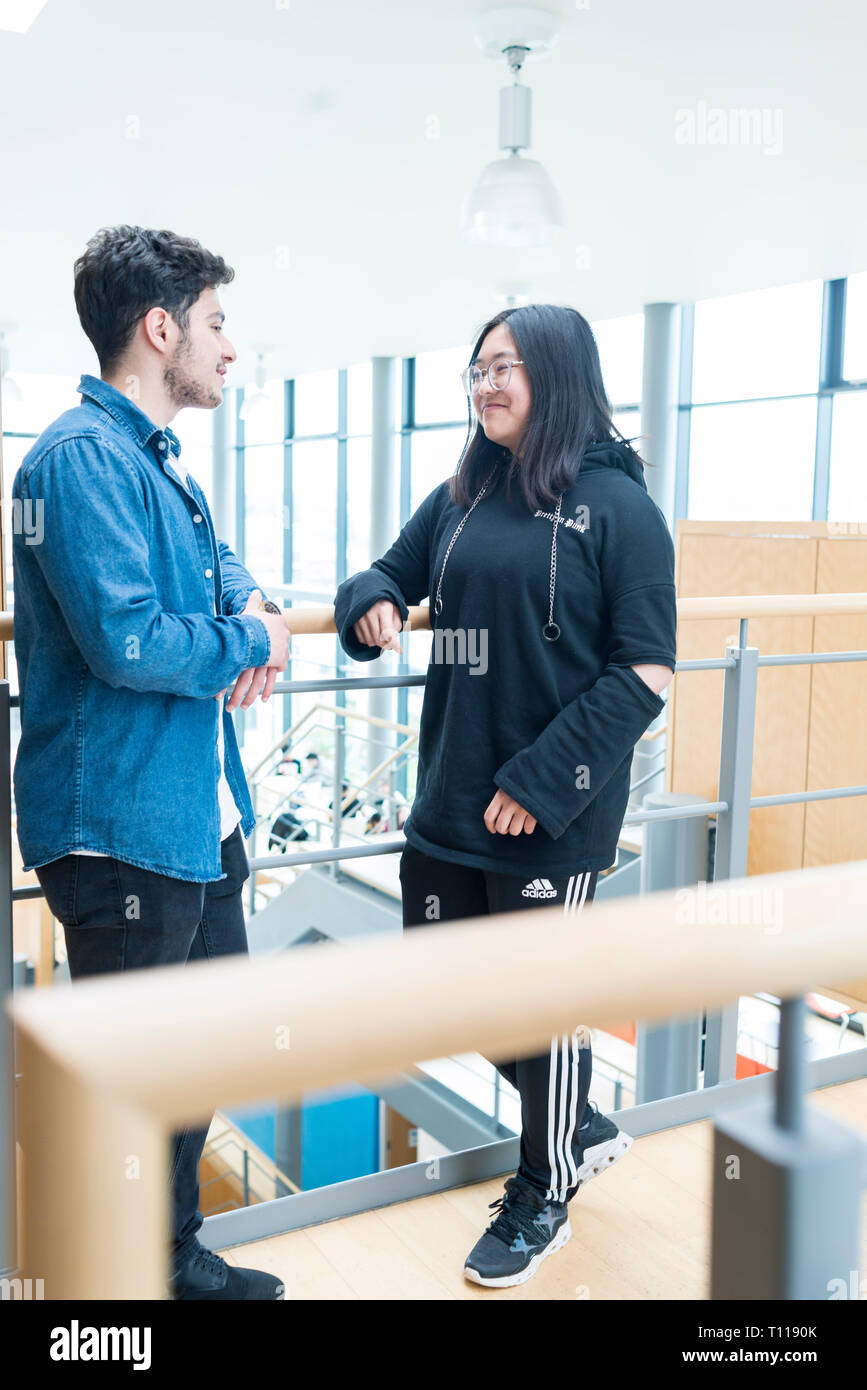 students hanging out and working in the social communal break out areas ...