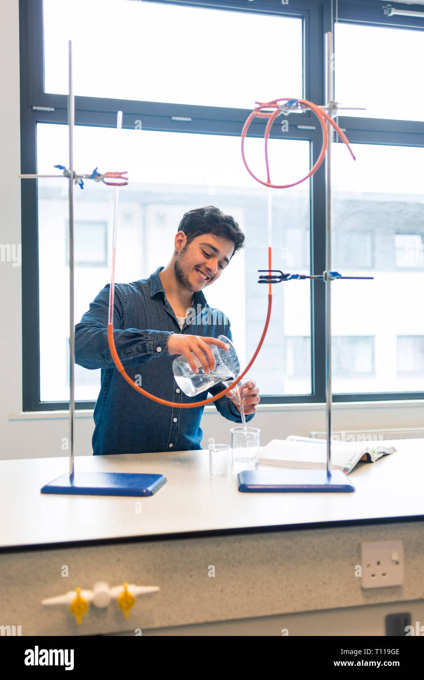 a male student in the science lab Stock Photo - Alamy