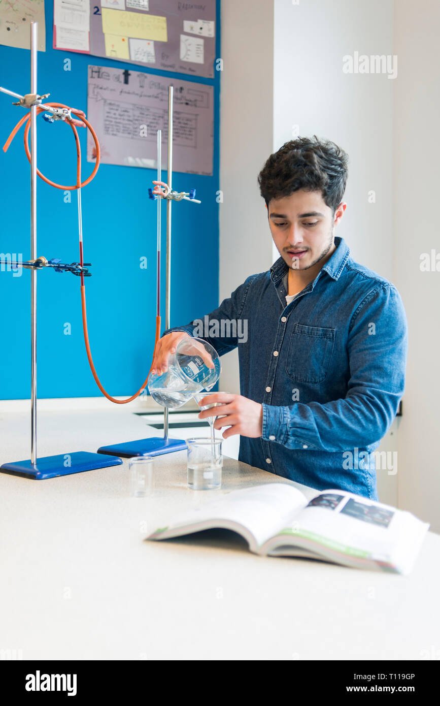 a male student in the science lab Stock Photo - Alamy