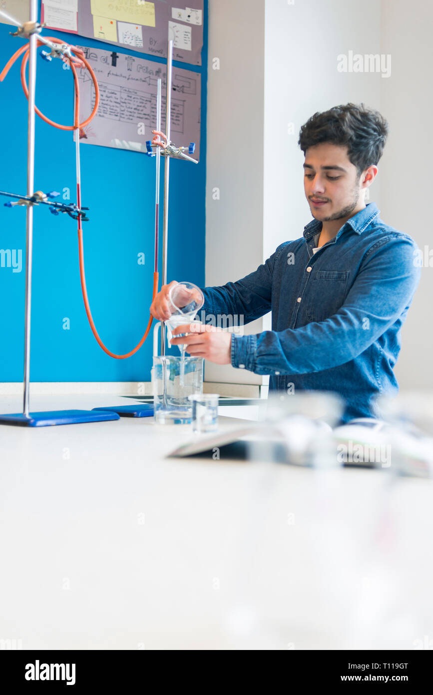 a male student in the science lab Stock Photo - Alamy