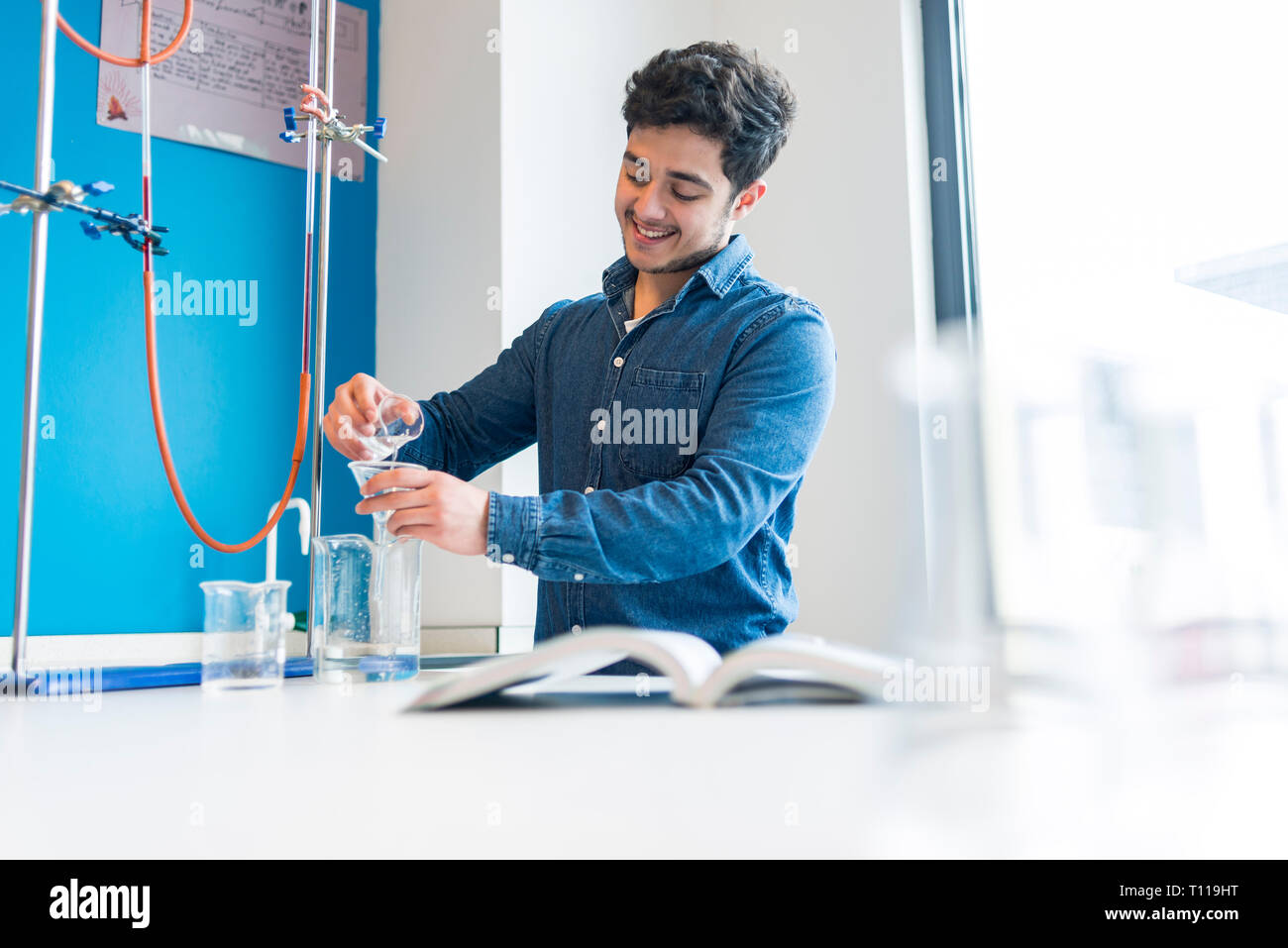 a male student in the science lab Stock Photo - Alamy
