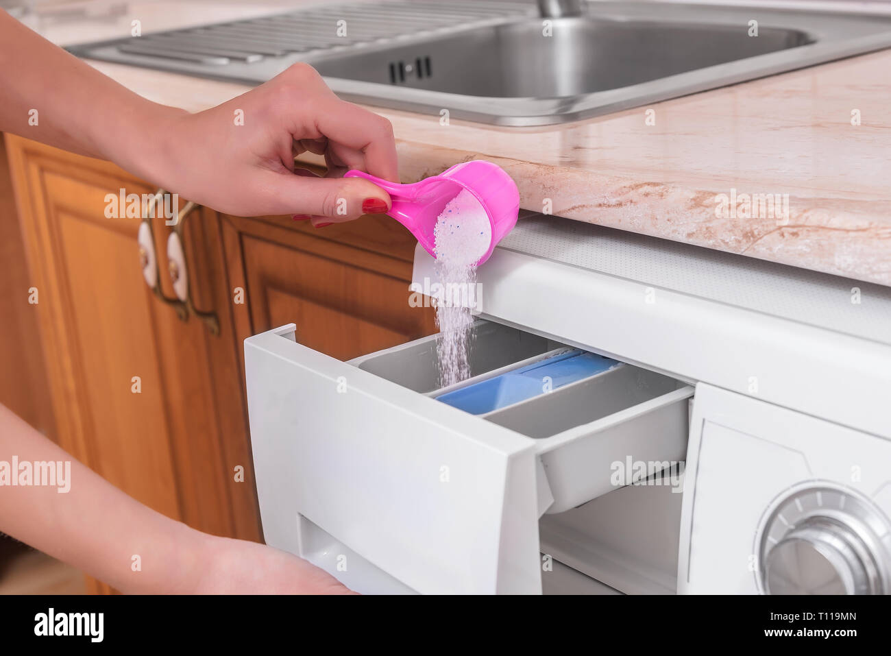 Woman powder washing machine hi-res stock photography and images - Alamy