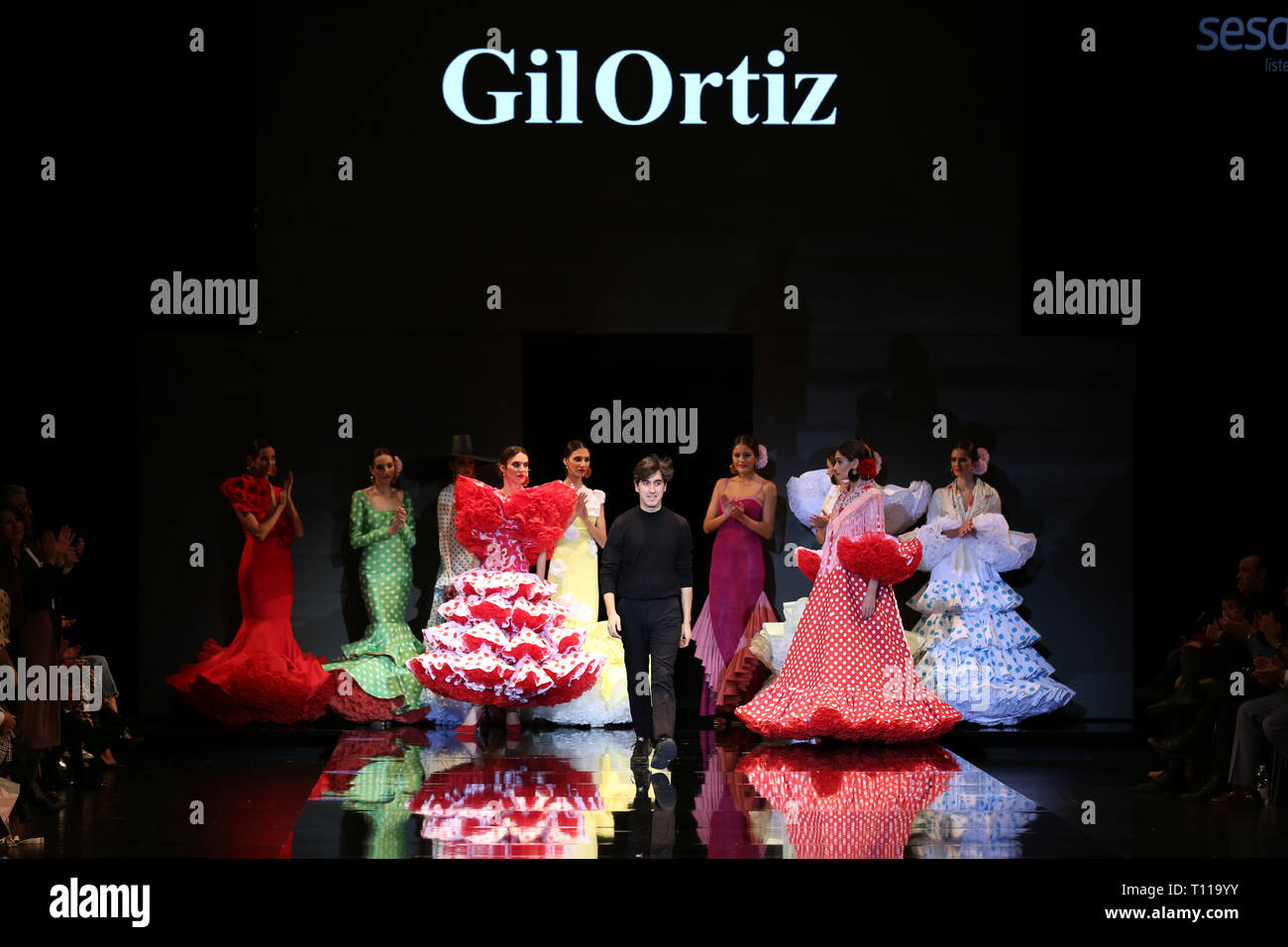 Designer Gil Ortiz and models on the catwalk Stock Photo - Alamy
