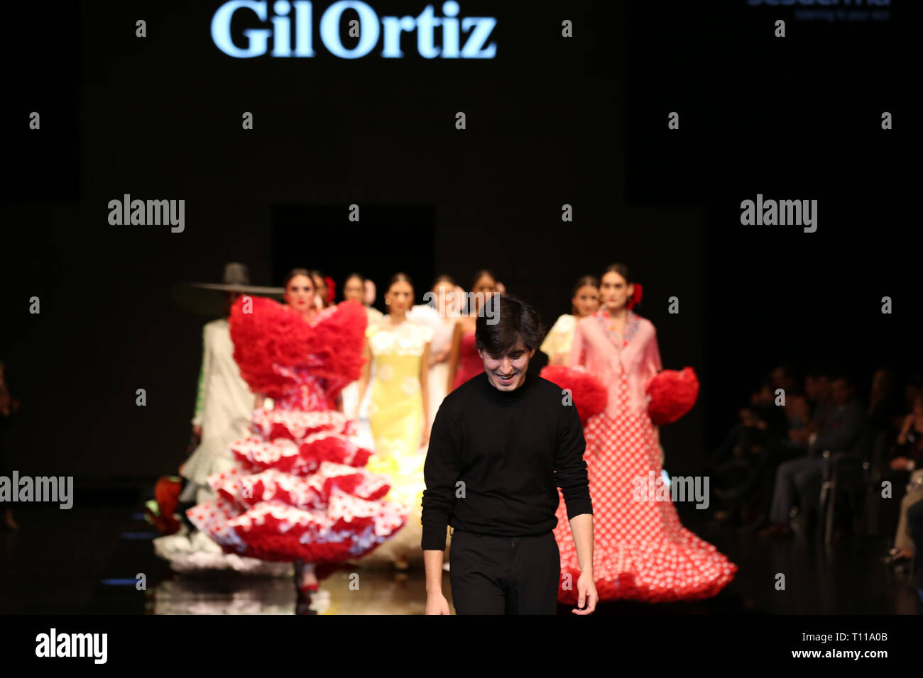 Designer Gil Ortiz and models on the catwalk Stock Photo - Alamy