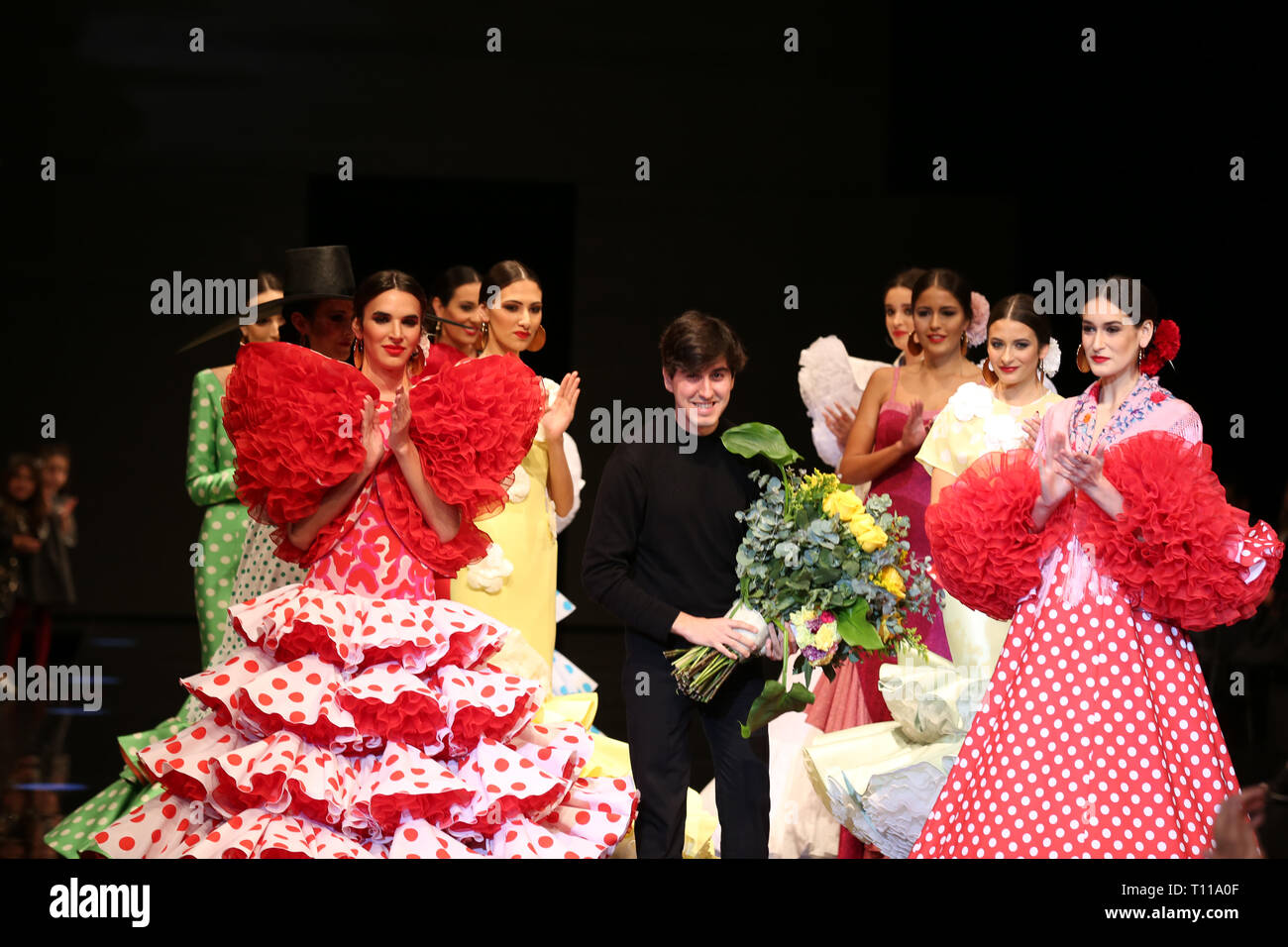 Designer Gil Ortiz and models on the catwalk Stock Photo - Alamy