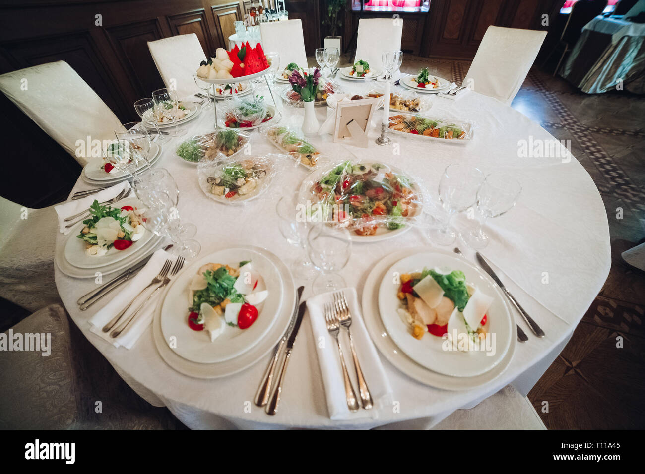 Many round plates with tasty vegetables dish of salads in restaurant ...