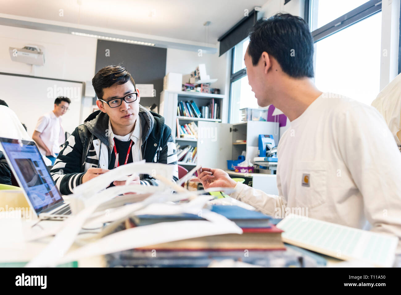 photos in an art lesson in the art class of a college with lots of ...