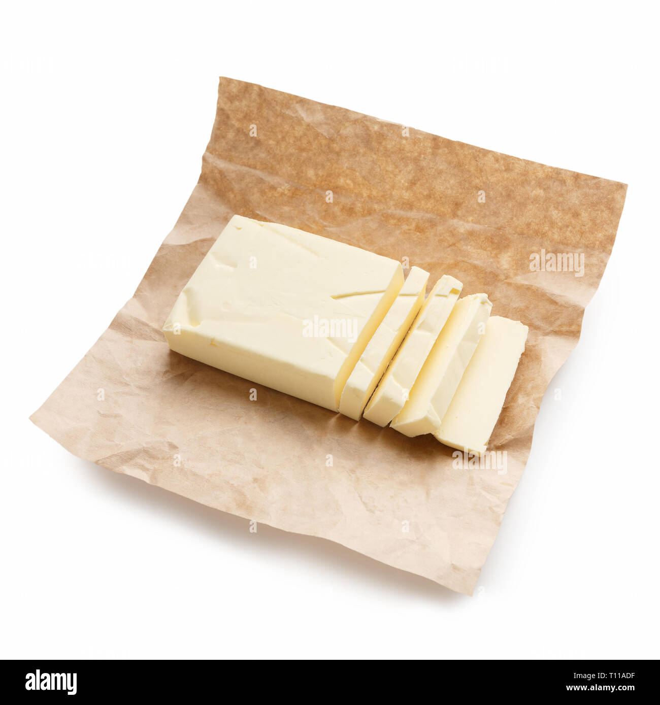Piece of butter on white background Stock Photo - Alamy