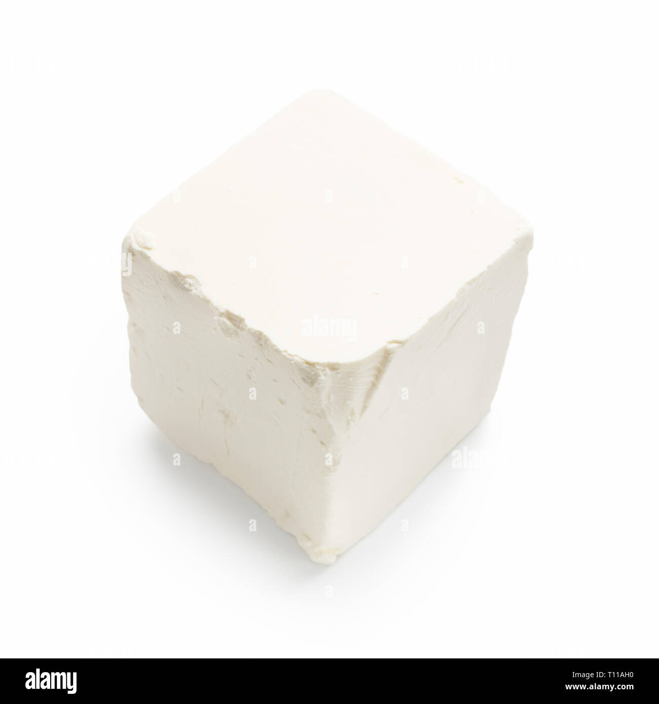 Feta cheese cube on white Stock Photo - Alamy