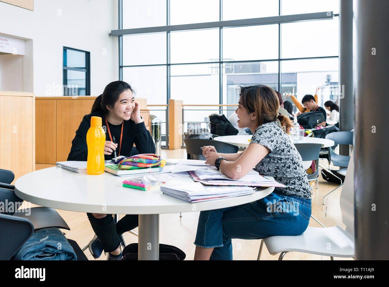 students hanging out and working in the social communal break out areas ...