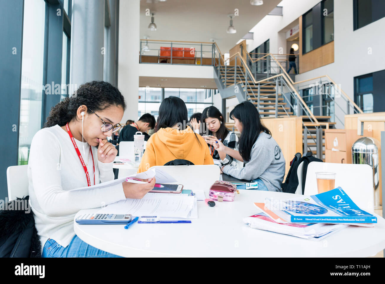students hanging out and working in the social communal break out areas ...