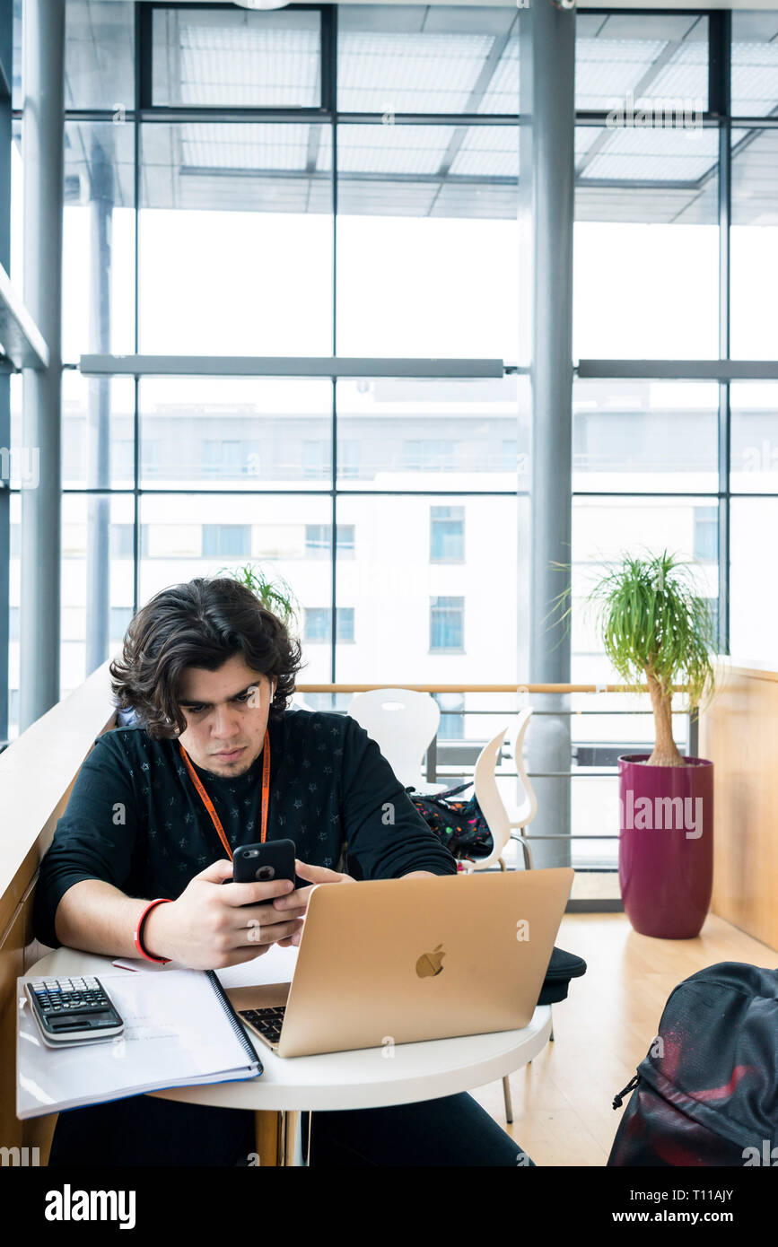 students hanging out and working in the social communal break out areas ...