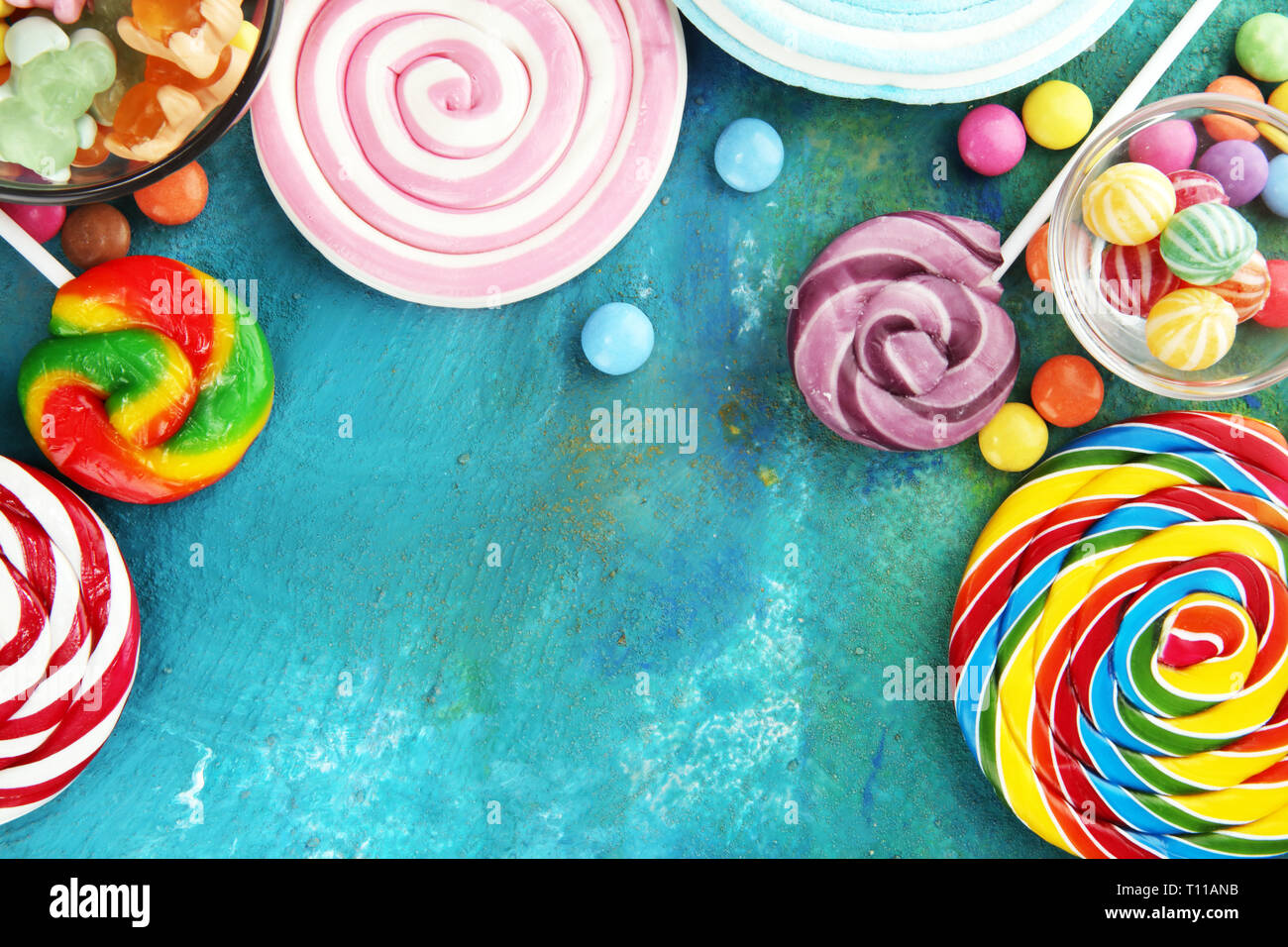 candies with jelly and sugar. colorful array of different childs sweets ...