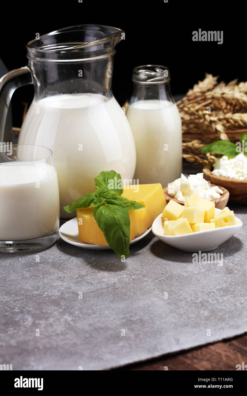 milk products. tasty healthy dairy products on a table and milk jar ...