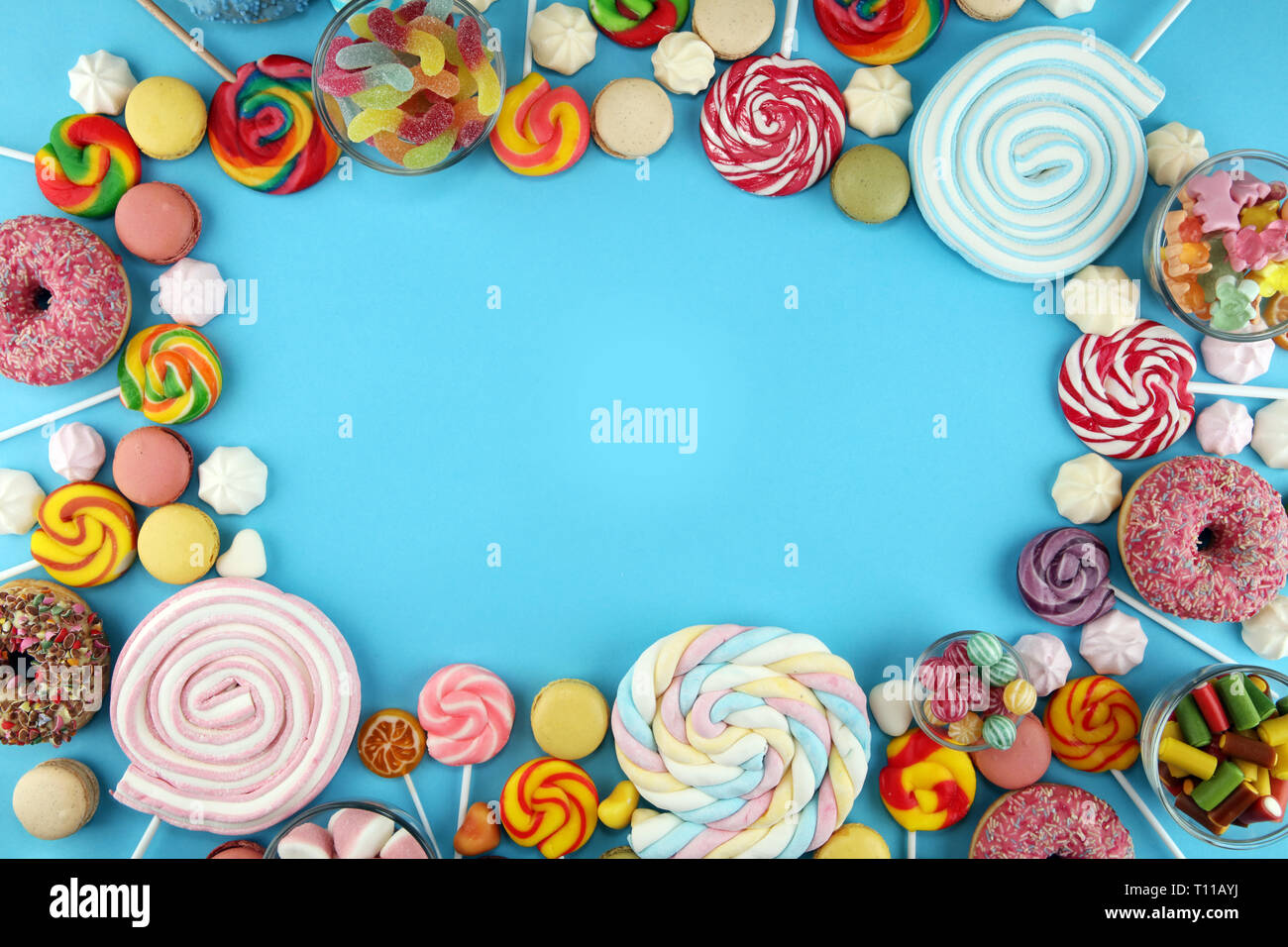 candies with jelly and sugar. colorful array of different childs sweets ...