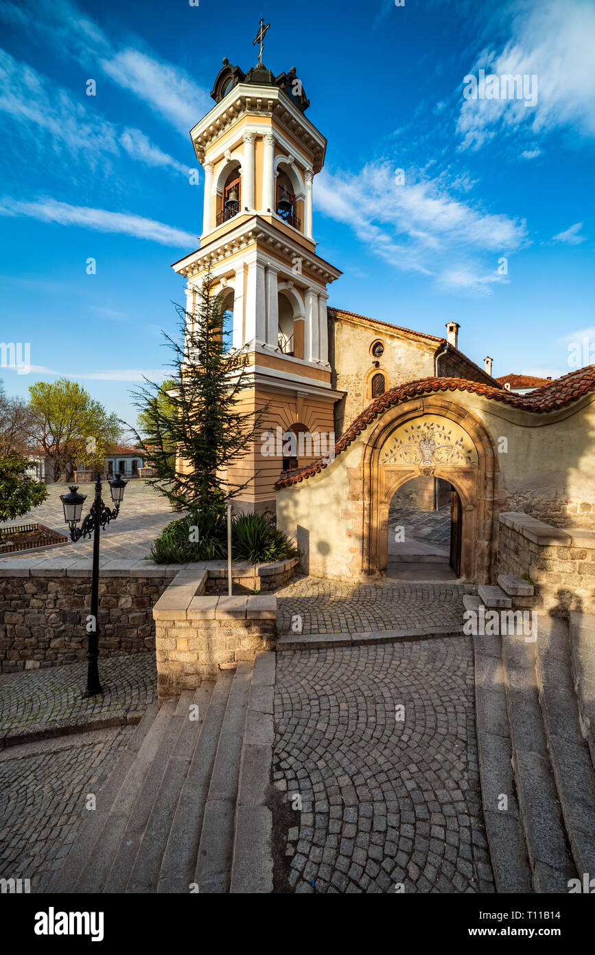 Colorful bell tower at entrance to Assumption of the Holy Virgin Church ...