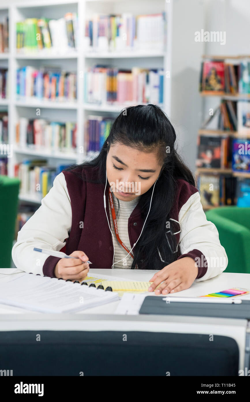 photos inside a college library with lots of students and books around ...