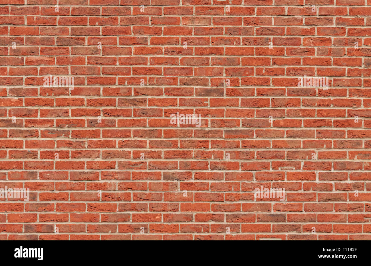 Laying a brick wall with red-hot bricks.Texture.Background Stock Photo ...