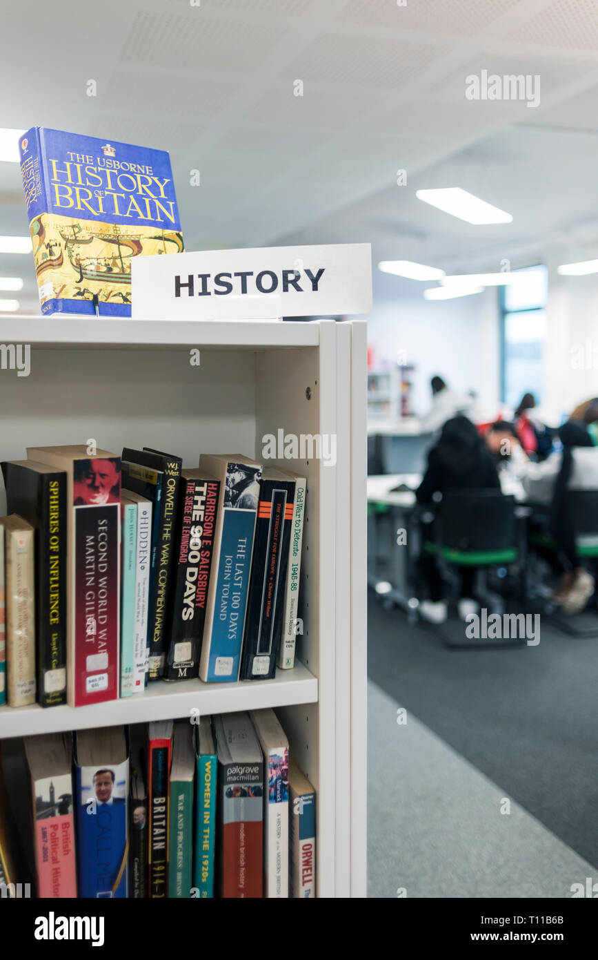 photos inside a college library with lots of students and books around ...