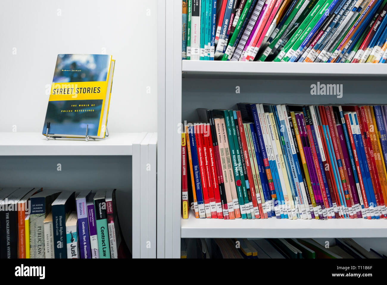 photos inside a college library with lots of students and books around ...
