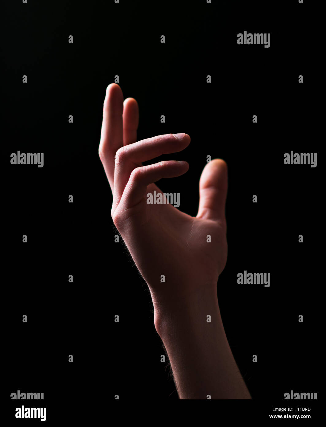 hand gesture isolated on black background Stock Photo - Alamy