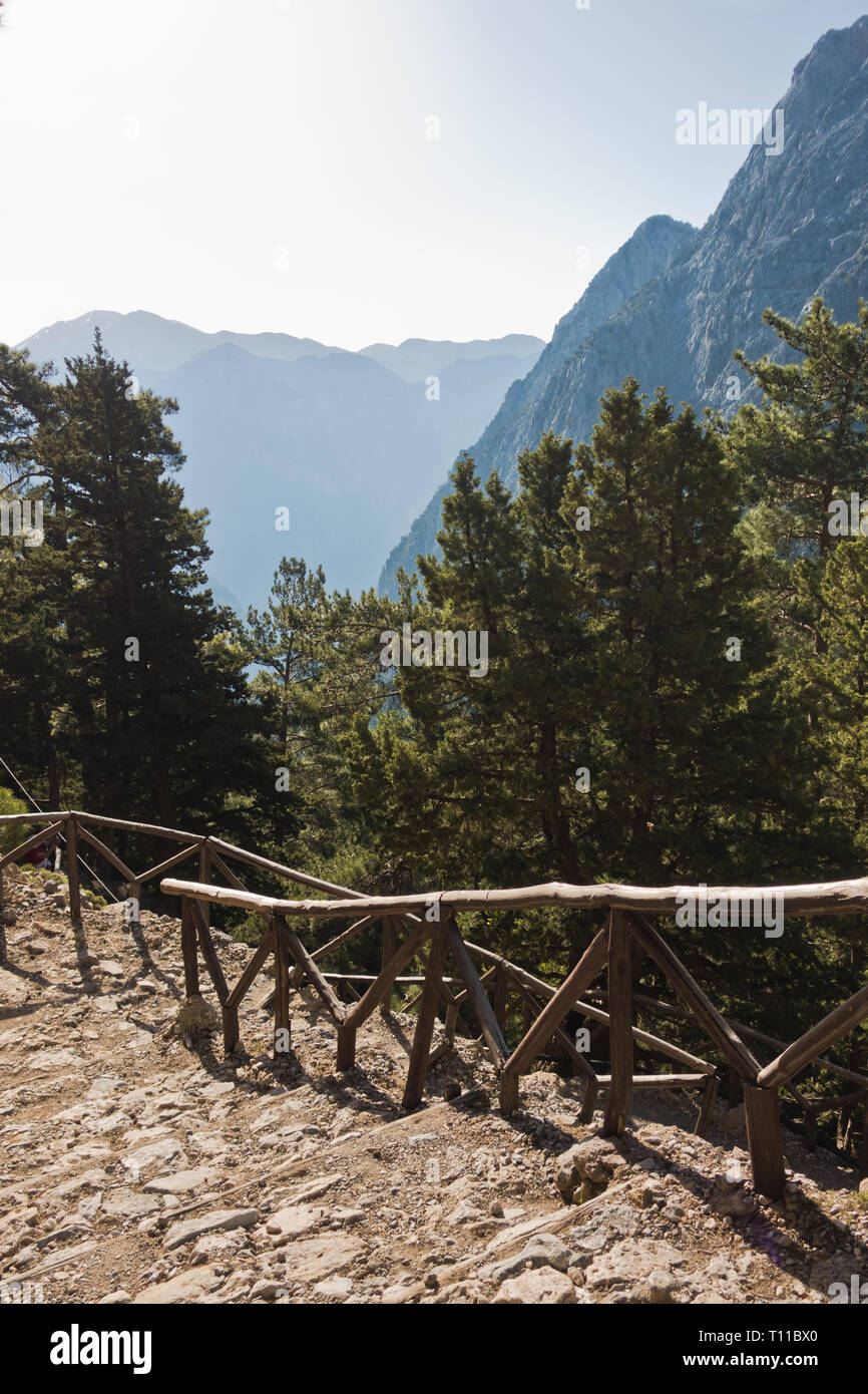 Entrance to Samaria gorge surrounded by very high mountains, south west ...