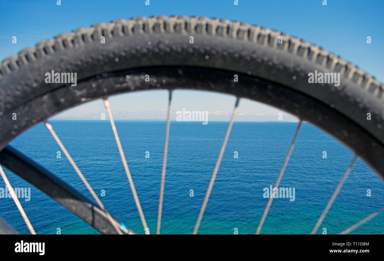 Ocean view through bike rim Stock Photo - Alamy