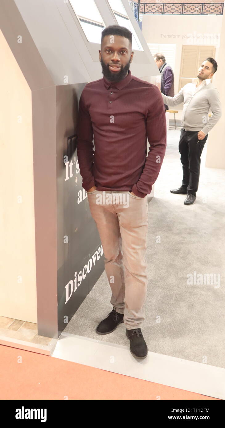 Ideal Home Show stand worker Stock Photo - Alamy