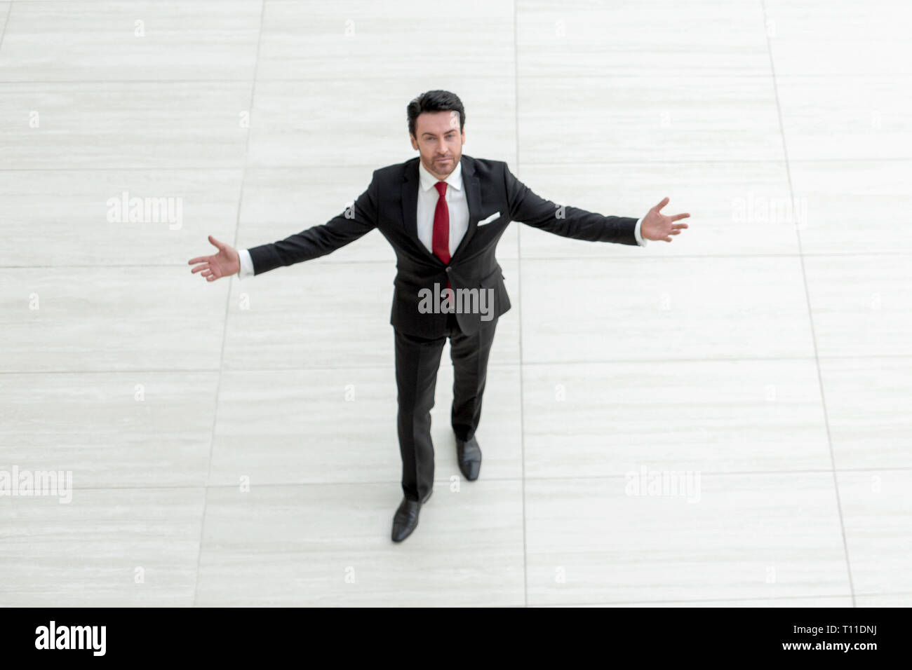 top view from afar.Businessman spreads his hands to the sides Stock ...