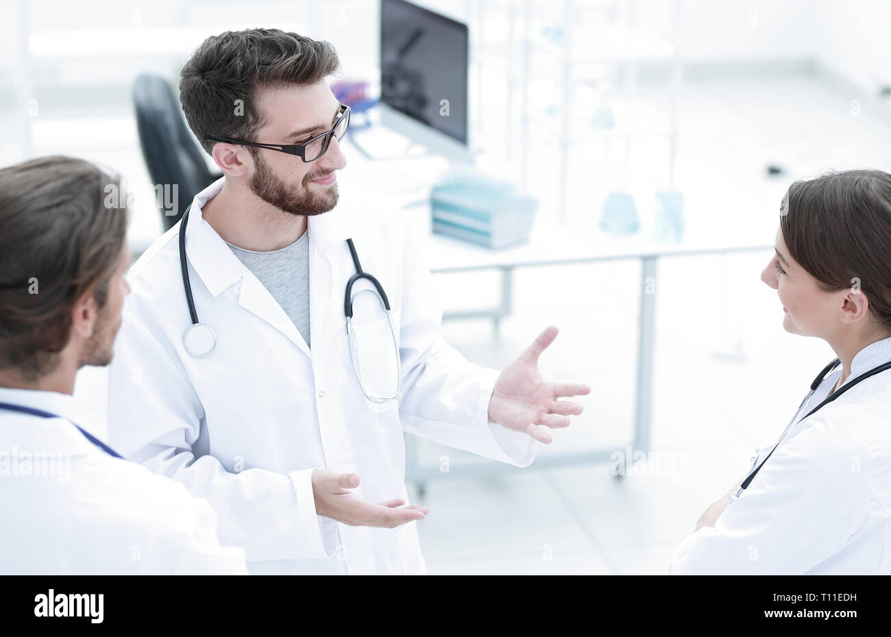 Group of doctors talking Stock Photo - Alamy
