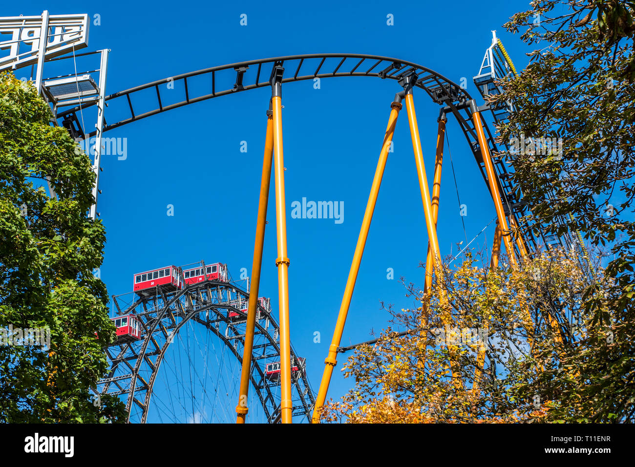 A rollercoaster and the world famous Weiner Riesenrad giant Ferris ...