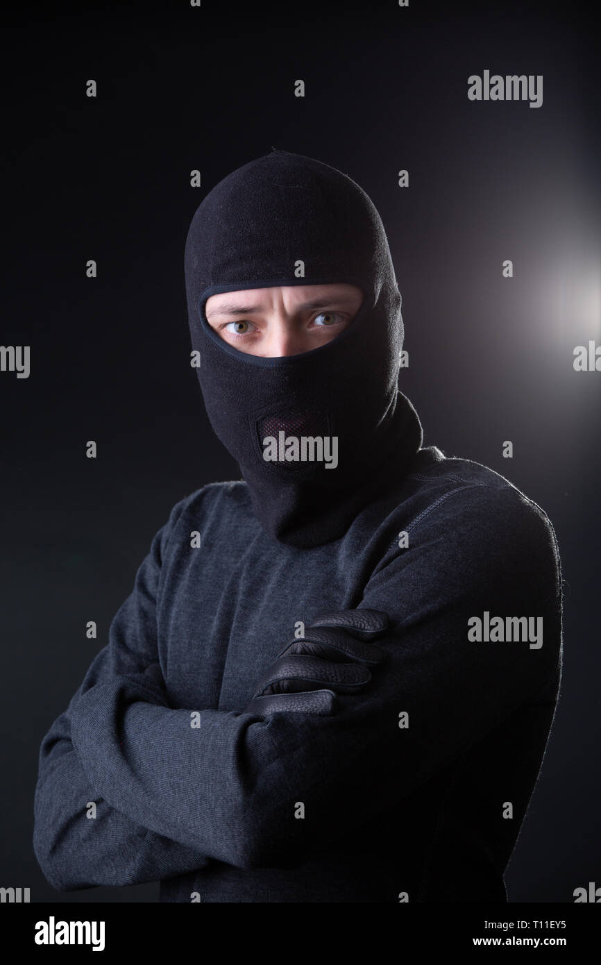 Robber man in bachelor with arms crossed Stock Photo - Alamy