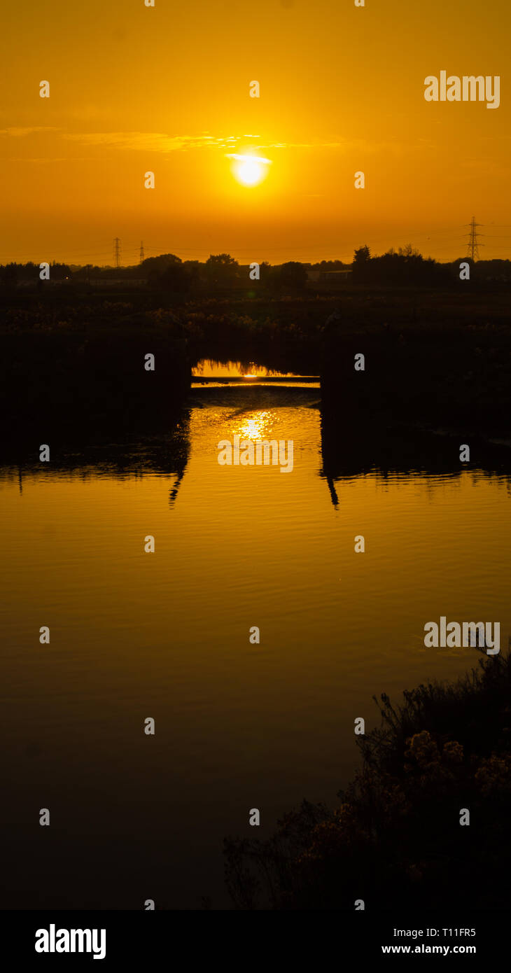 Heybridge Basin at Maldon lock at sunset silhouette Stock Photo - Alamy