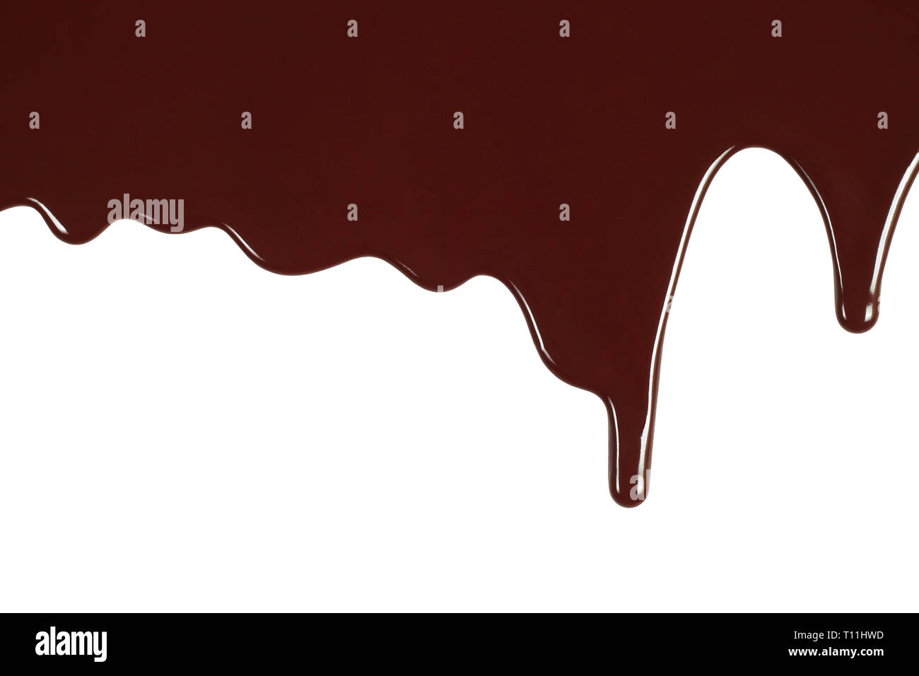 Melted chocolate dripping on white background close-up Stock Photo - Alamy