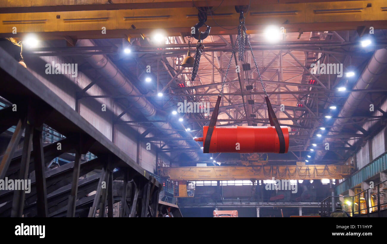 Industrial concept. A crane lifting on a big detail Stock Photo - Alamy